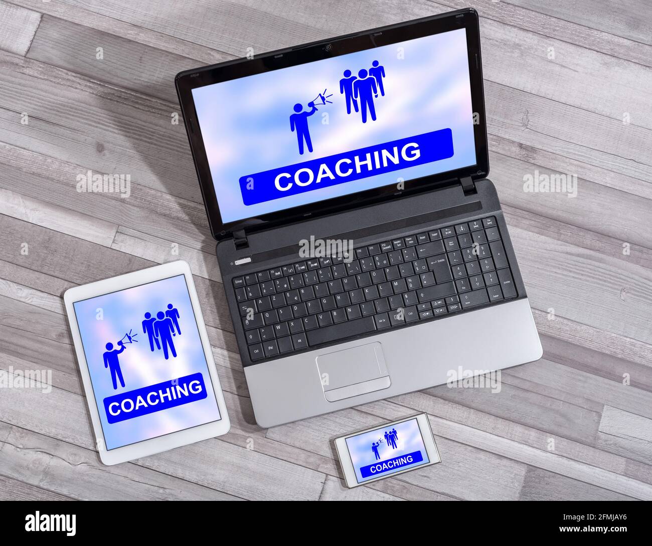 Coaching concept shown on different information technology devices ...
