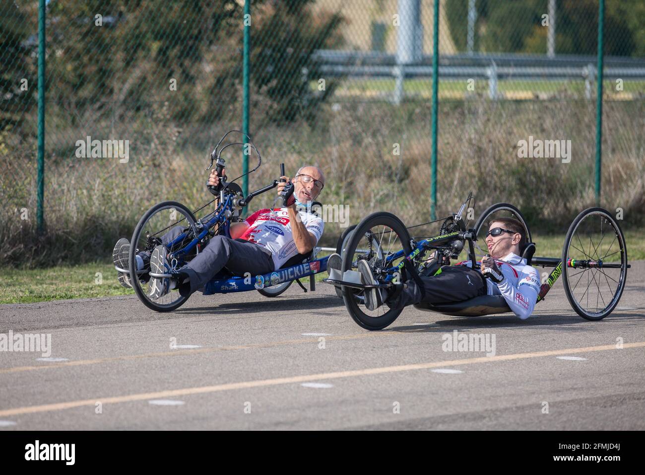 Couple of Disabled Athlete training with Their Hand Bikes on a Track ...