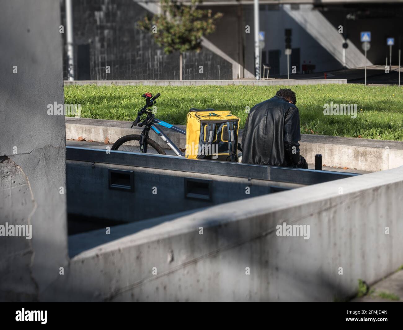 Boy Delivering Food at Home who is Resting Outdoor Sitting Next to His ...