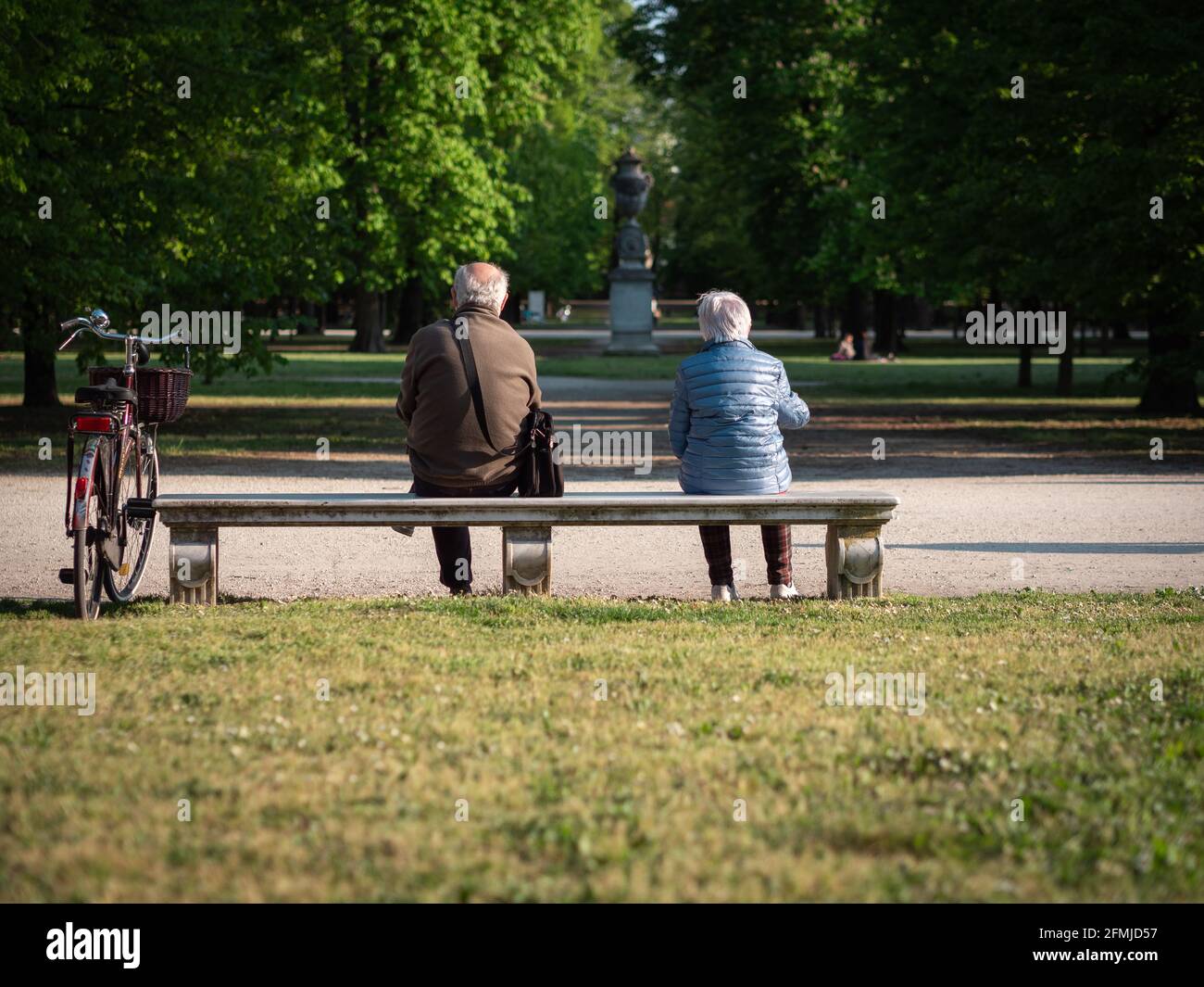 People Sitting Apart On A Bench