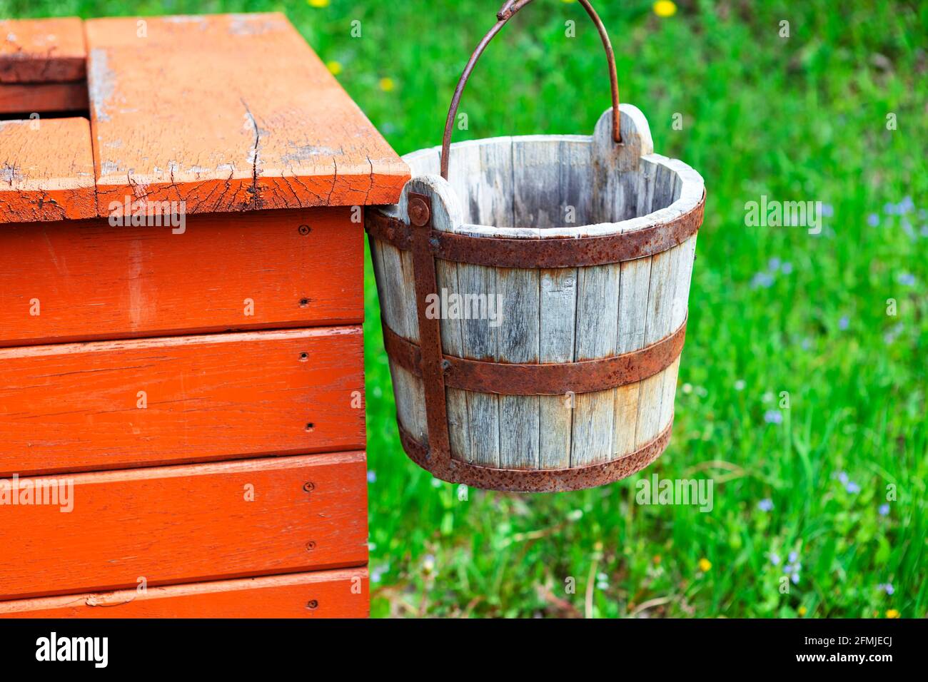 Wooden bucket of water well . Traditional water well in village Stock ...