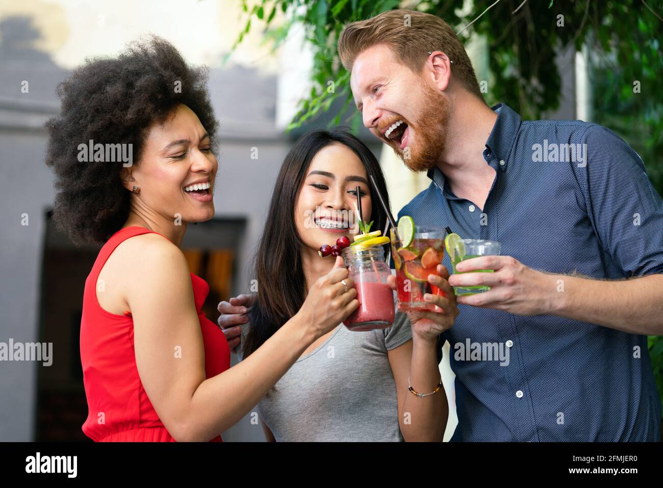 Group of friends having fun together. People talking laughing and ...
