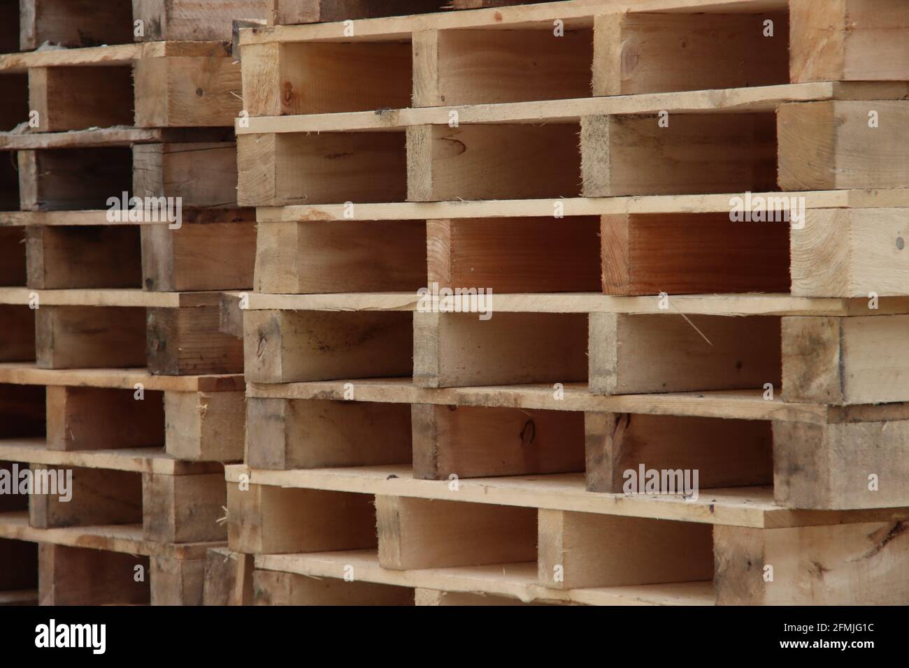 Stack of wooden pallets for use in warehouse or transport Stock Photo ...