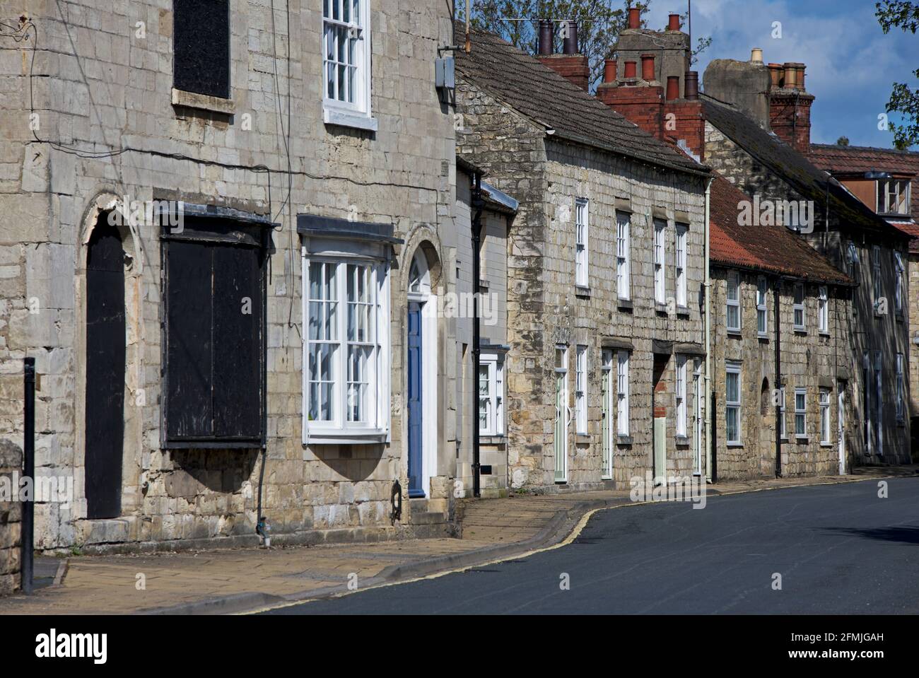 Terrace of houses built from the local limestone, Tadcaster, North ...