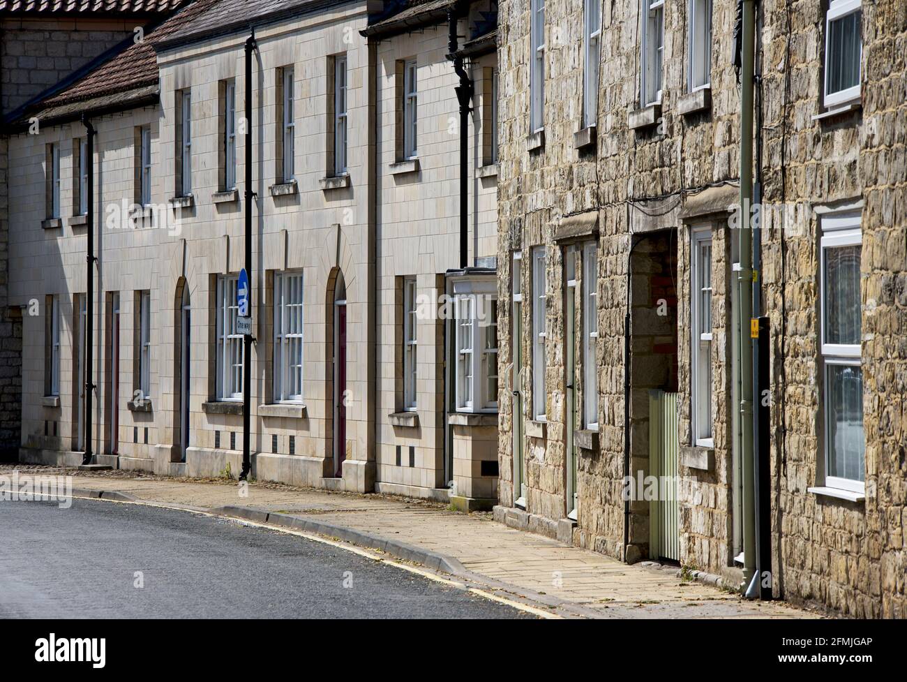 Terrace of houses built from the local limestone, Tadcaster, North ...