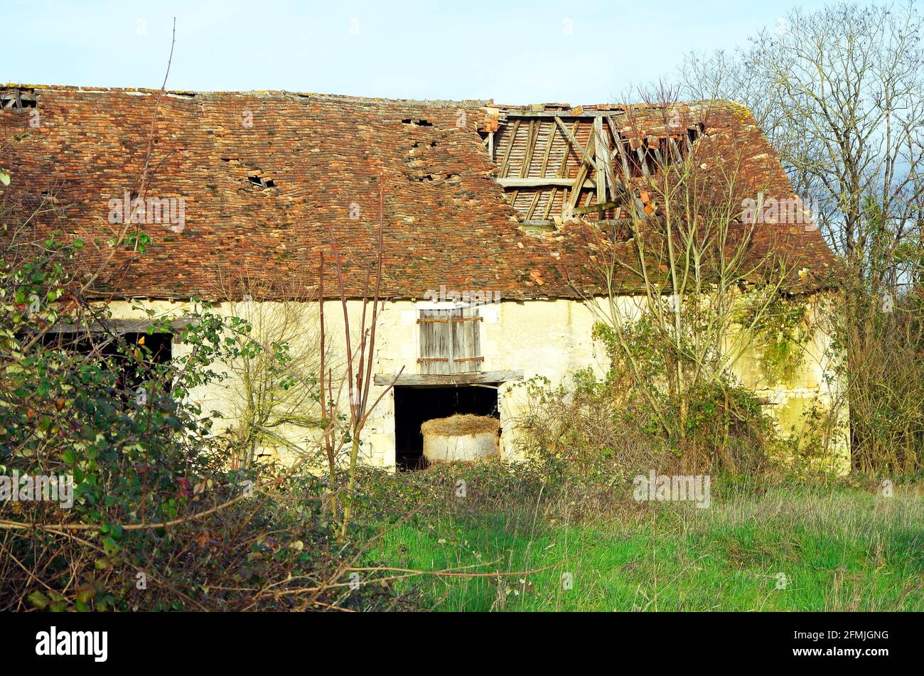 Traditional stone-built barn with timber roof structure and tiled roof ...