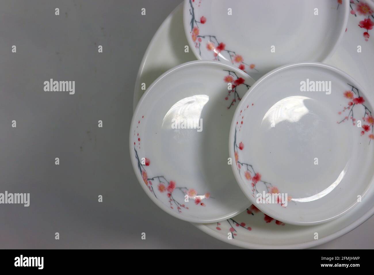 ceramic cup and plate closeup on white background Stock Photo - Alamy