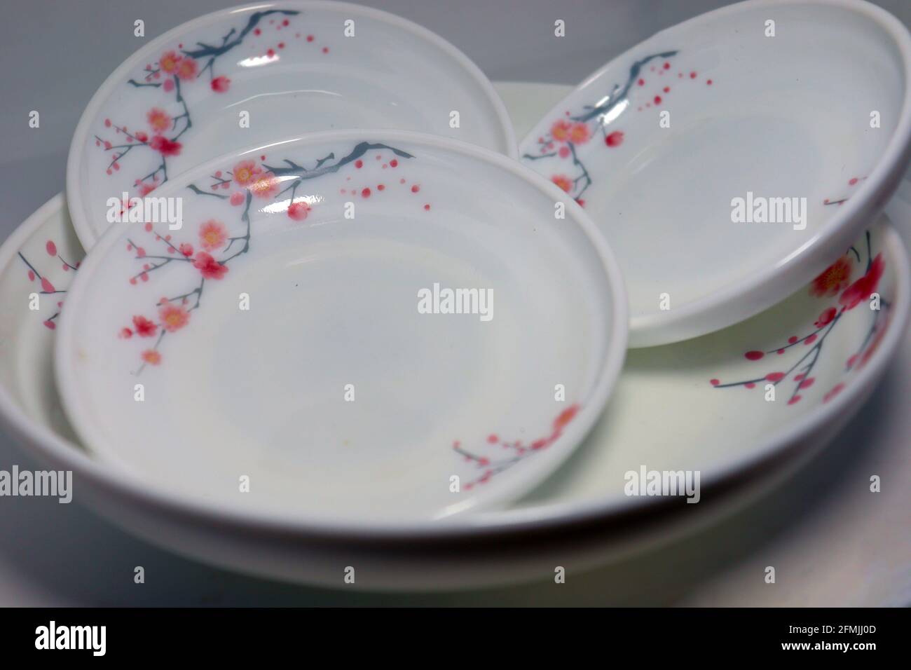 ceramic cup and plate closeup on white background Stock Photo - Alamy