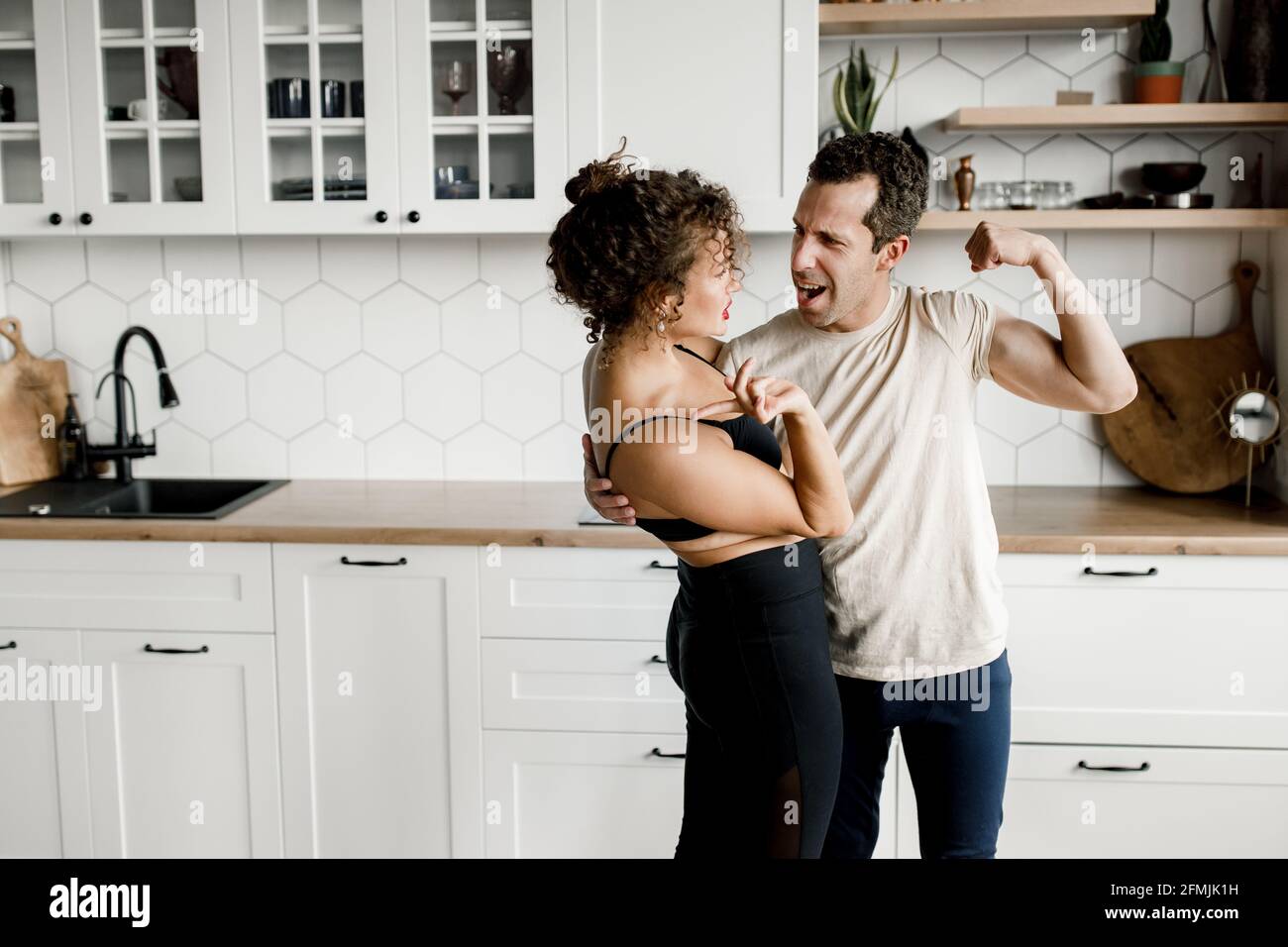 Women muscle strength showing biceps hi-res stock photography and ...