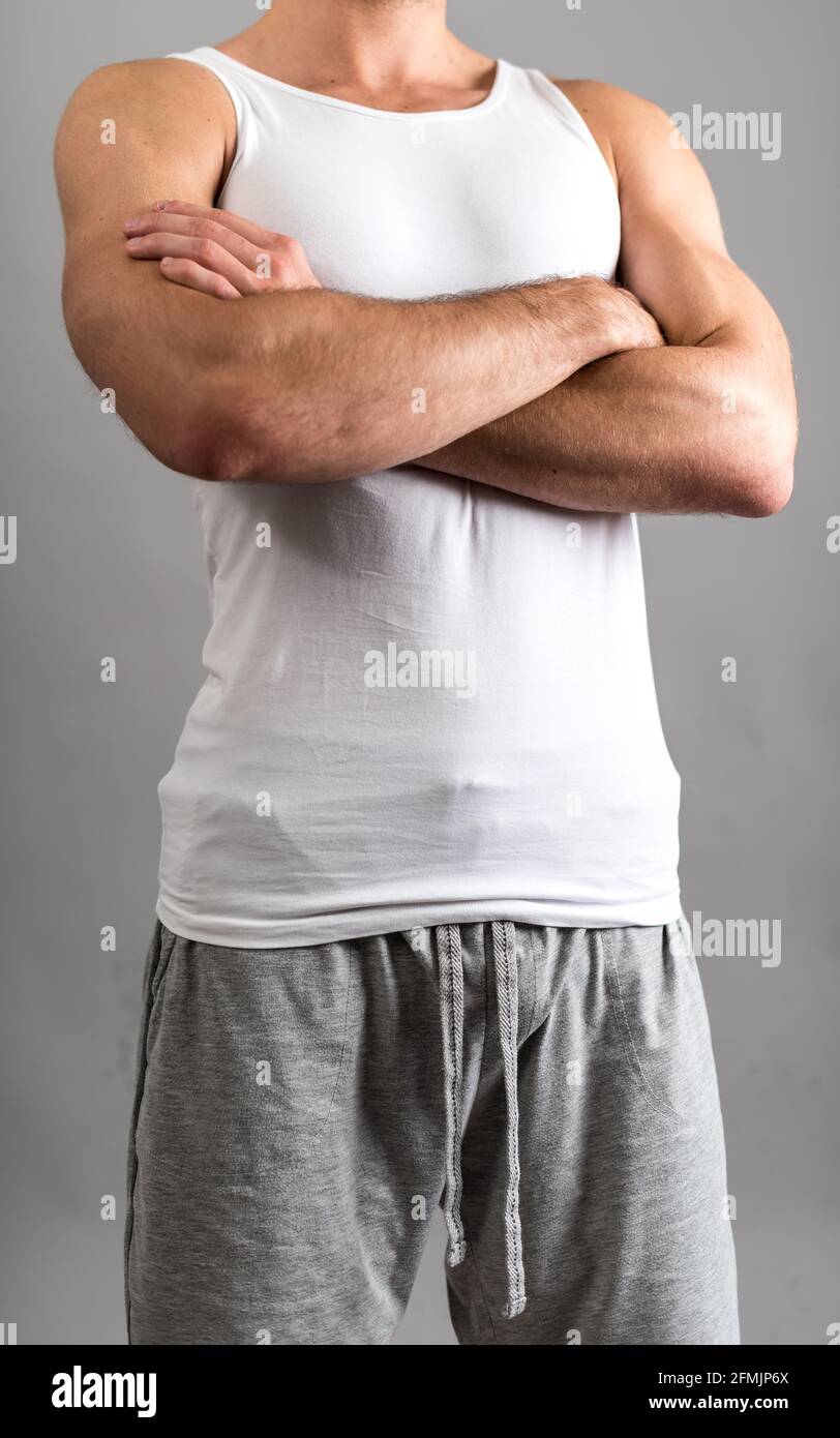 Athletic man with crossed arms Stock Photo - Alamy