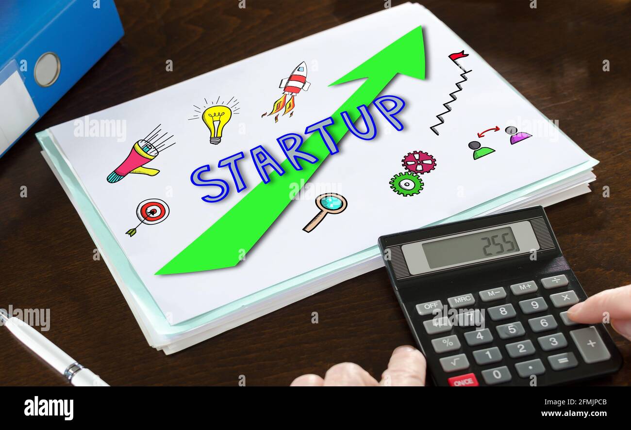 Startup concept illustrated on a paper with a calculator Stock Photo ...