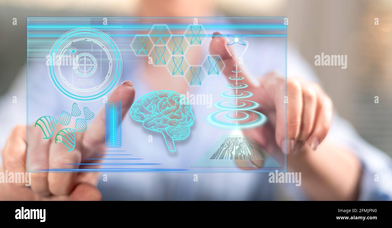 Woman touching a futuristic technologies concept on a touch screen with ...