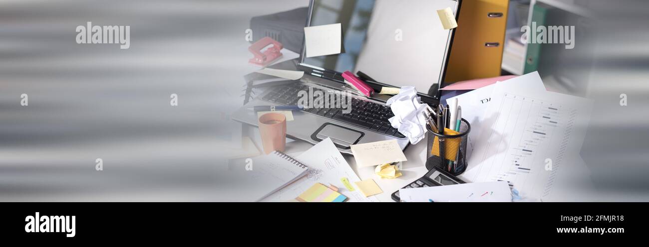 Messy and cluttered office desk Stock Photo - Alamy