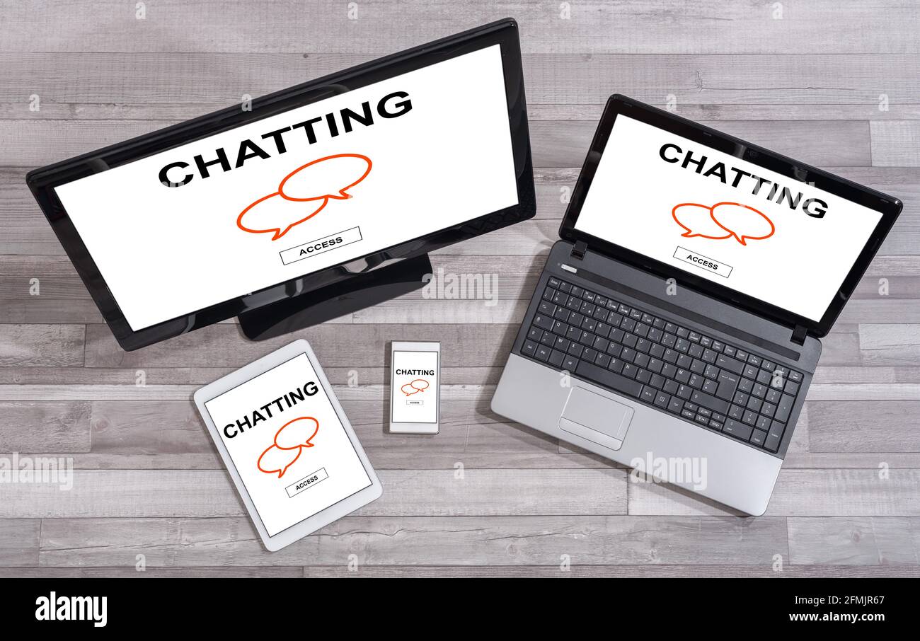 Chatting concept shown on different information technology devices ...