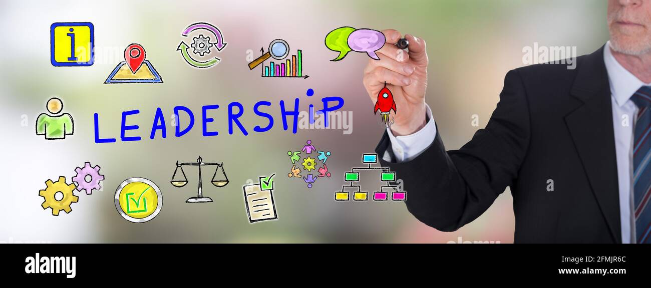 Businessman drawing a leadership concept Stock Photo - Alamy