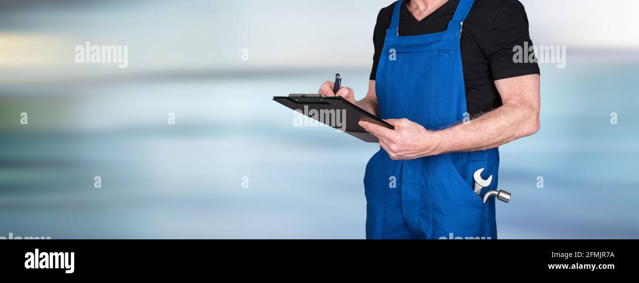 Car mechanic taking notes on clipboard on blurred background Stock ...