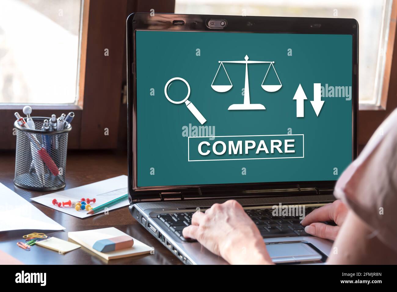 Laptop screen displaying a compare concept Stock Photo - Alamy