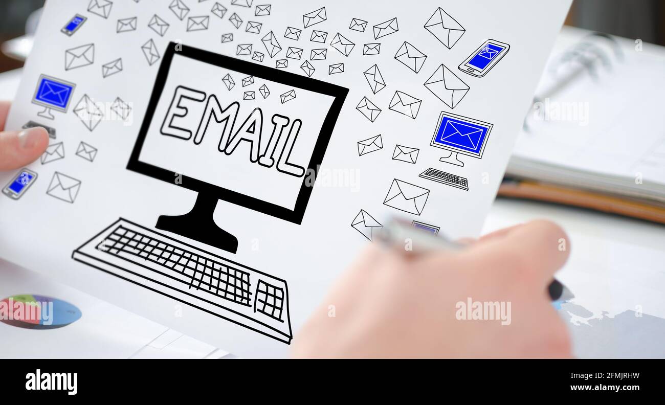Hands holding a paper showing an email concept Stock Photo - Alamy