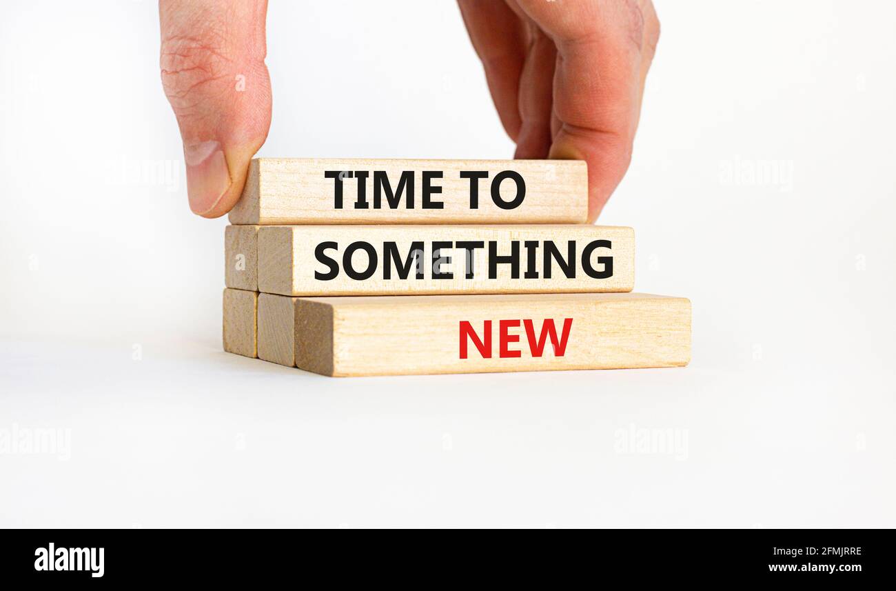 Time to something new symbol. Wooden blocks with words 'Time to ...