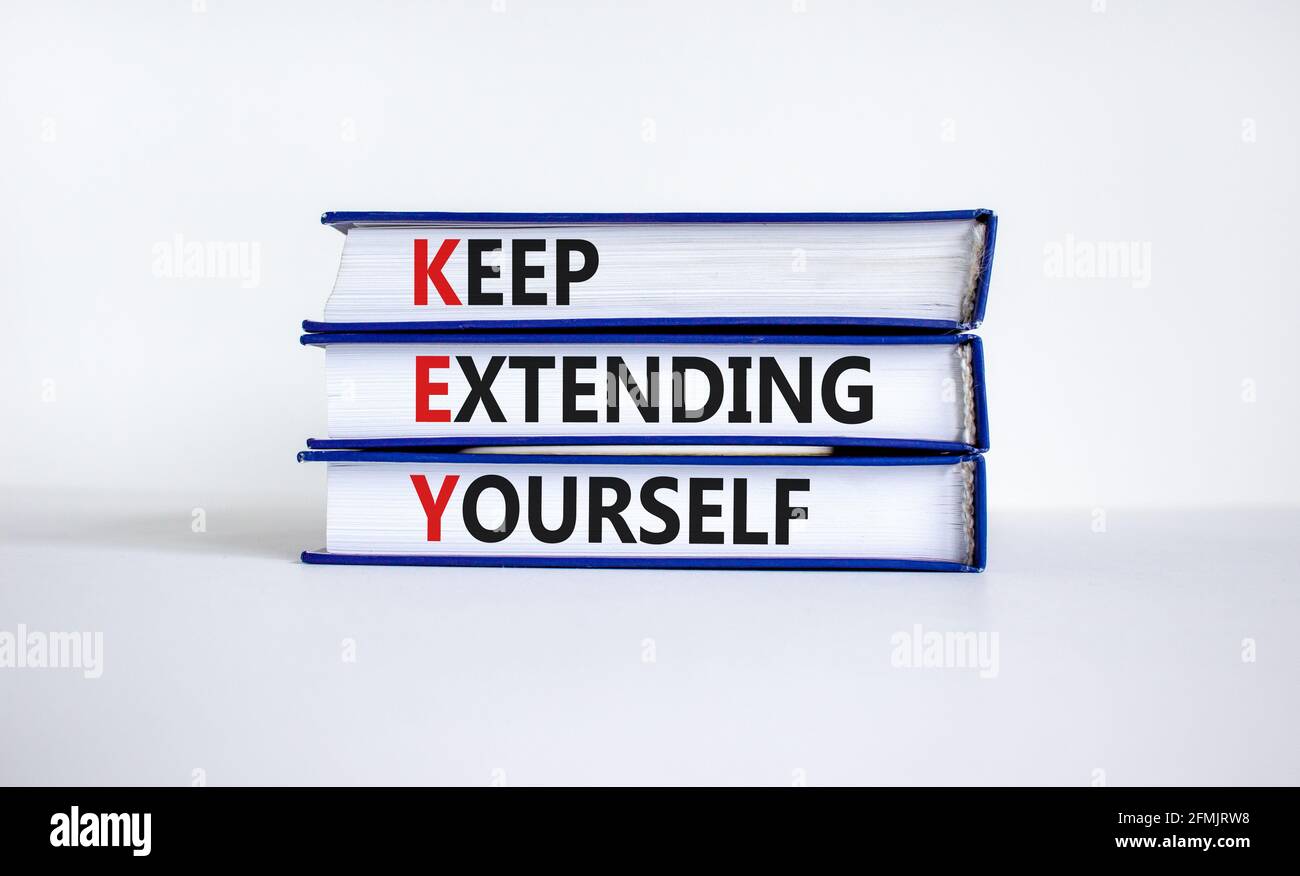 KEY, keep extending yourself symbol. Books with words 'KEY, keep ...