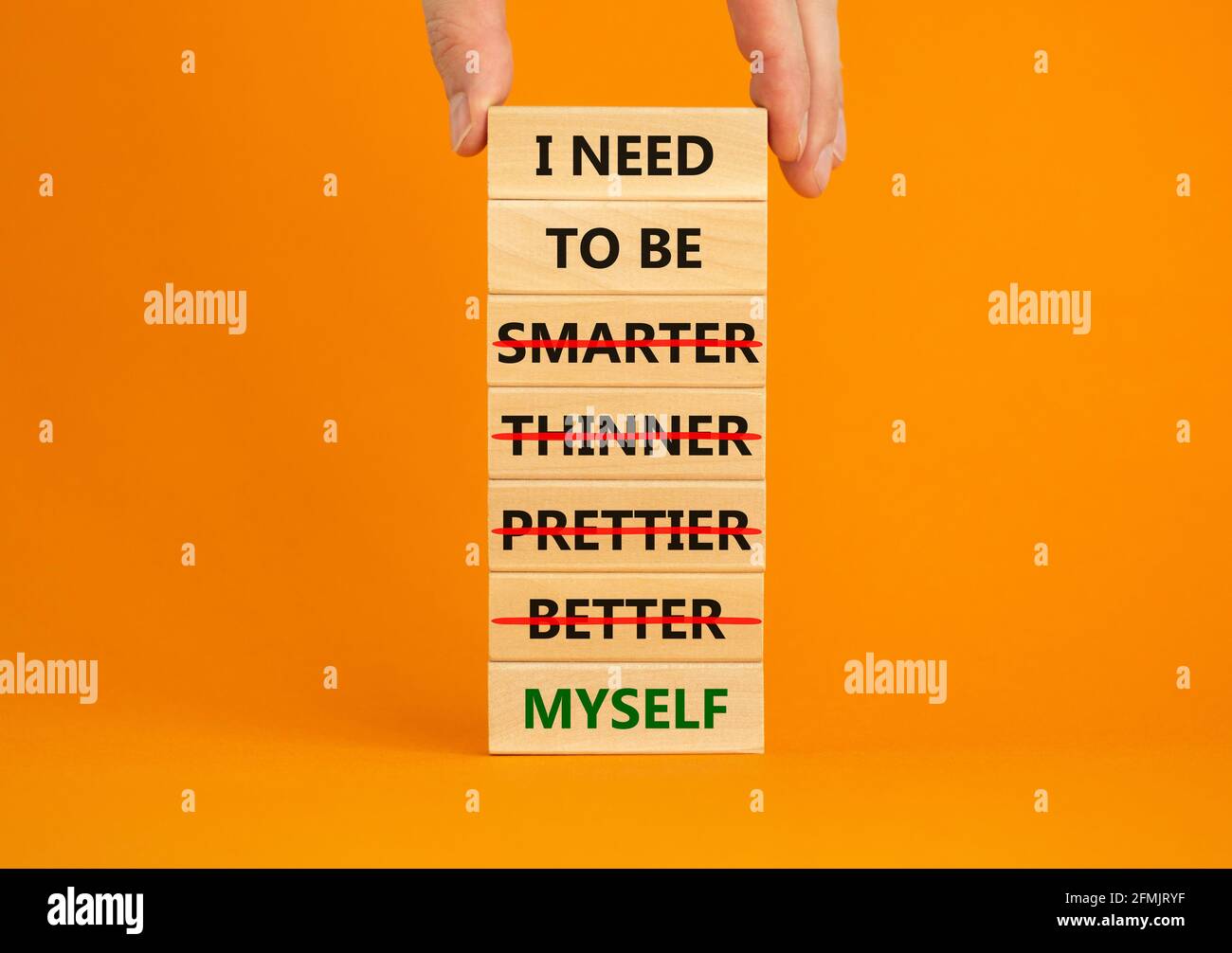 Be myself symbol. Businessman hand. Wooden blocks with words 'i need to ...