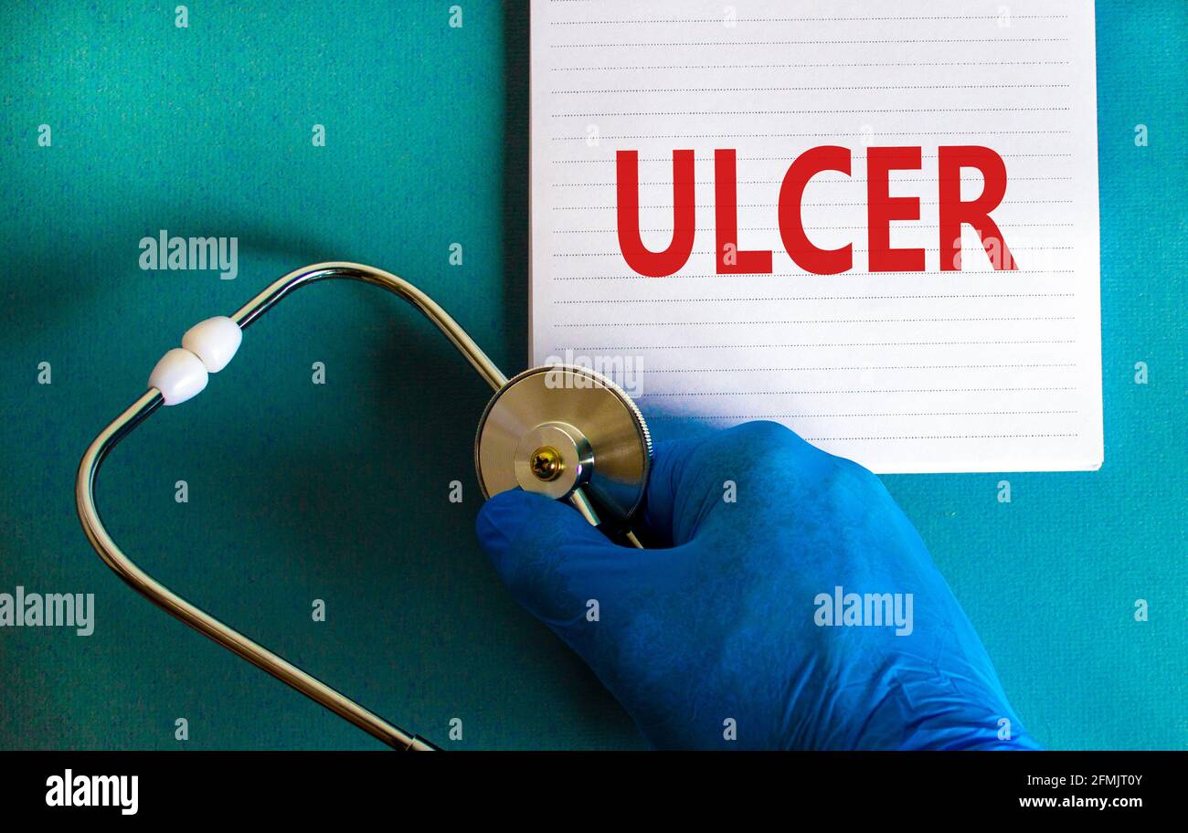 Medical and stomach ulcer symbol. Doctor hand, stethoscope. White note ...