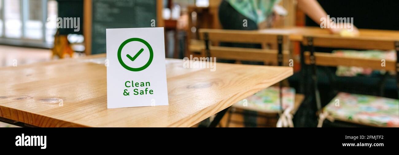 Clean and Safe sign placed on a table Stock Photo - Alamy