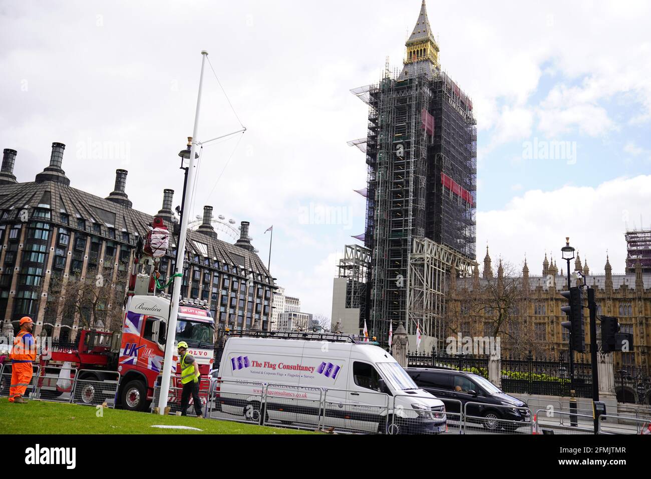 Contractors erect flagpoles in London's Parliament Square ahead of the ...