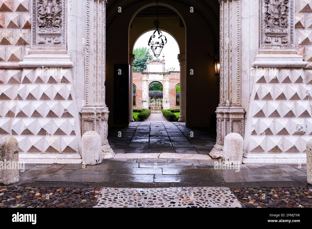 An arched entrance to the Diamanti Palace in Ferrara Italy Stock Photo ...