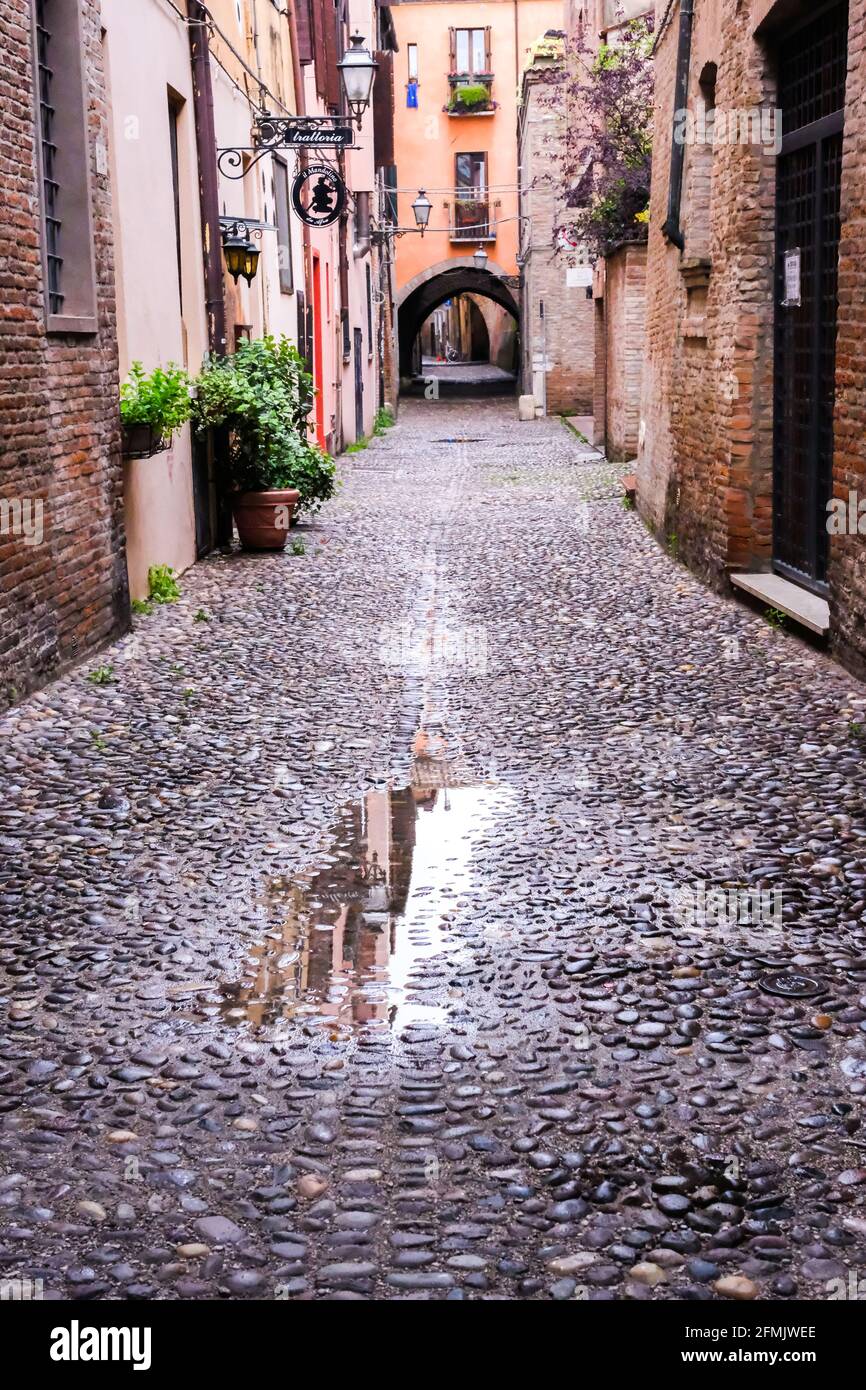 The historic cobblestone street Via delle Volte in Ferrara Italy Stock ...