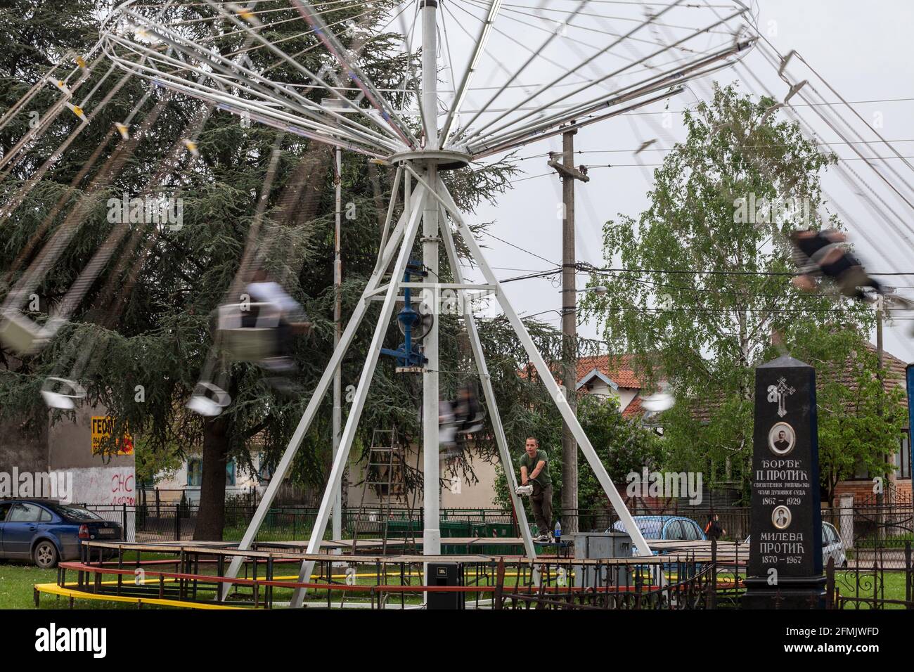 Picture of a swing ride rotating during a carnival in an amusement park ...