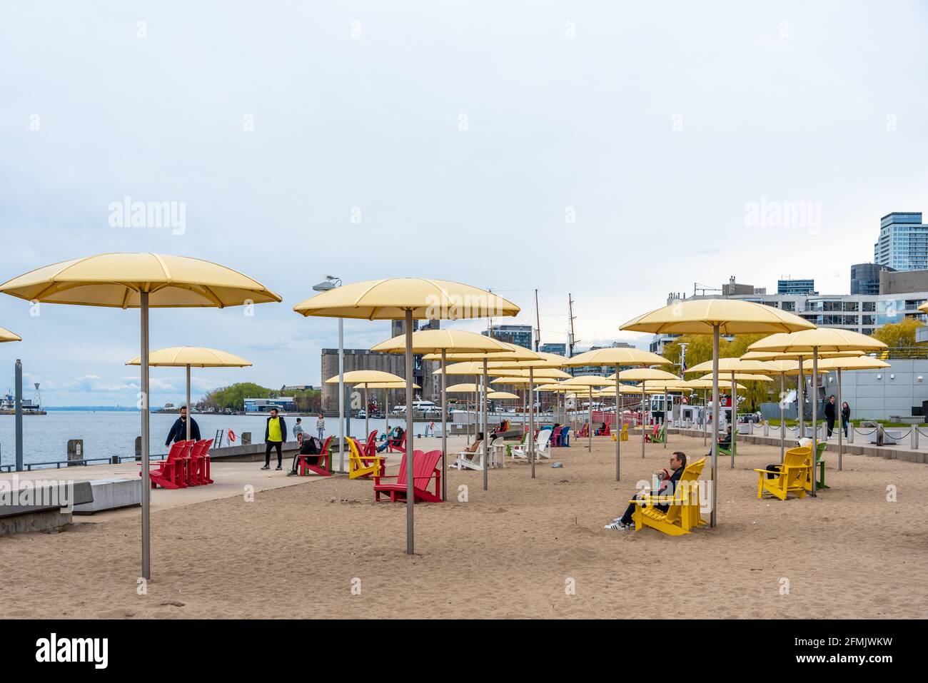 The HTO Park Beach with its traditional yellow umbrellas in Toronto ...