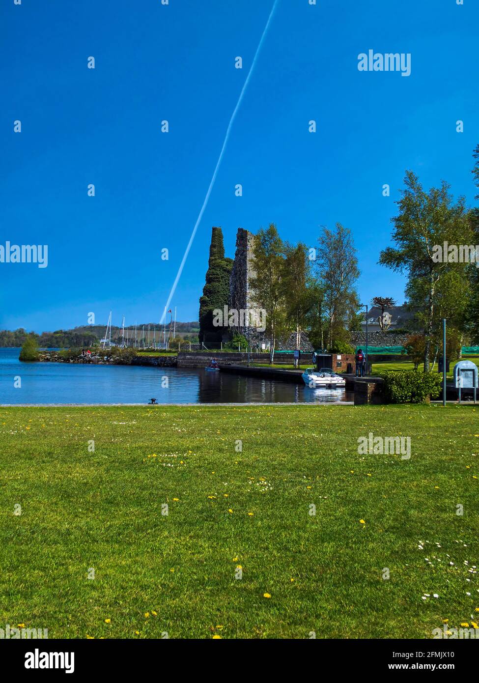 Remains of the Dromineer Castle standing on the shore of Lough Derg in ...