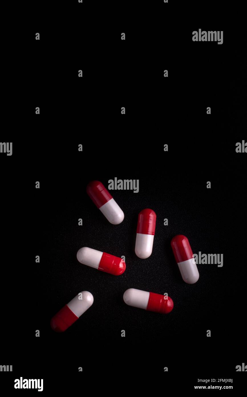 Black red drug pill vitamin hi-res stock photography and images - Alamy
