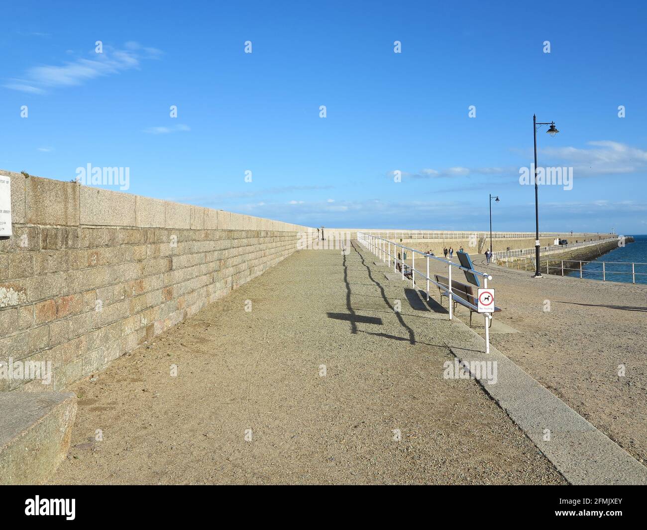 Beach head and coastal promenade at St Helier on the Channel Island of ...