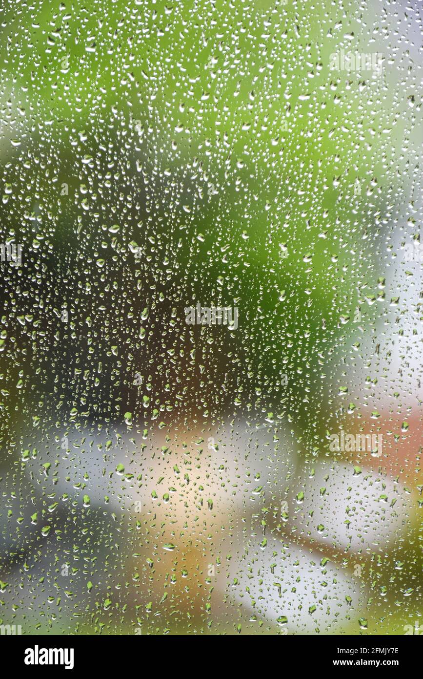 Water droplets on glass window pane from rain Stock Photo - Alamy