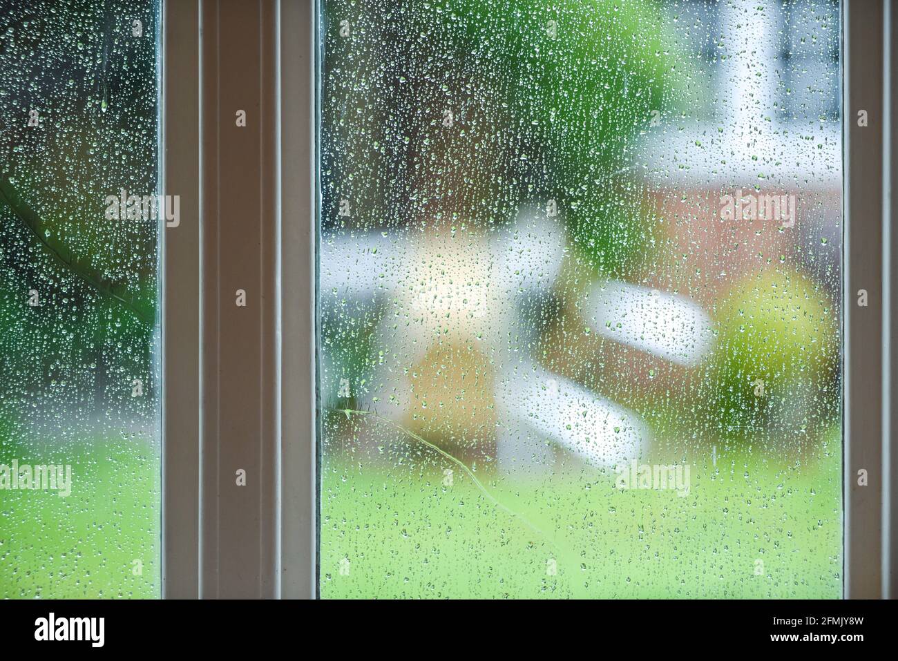 Kitchen interior view on a rainy day looking through window Stock Photo ...