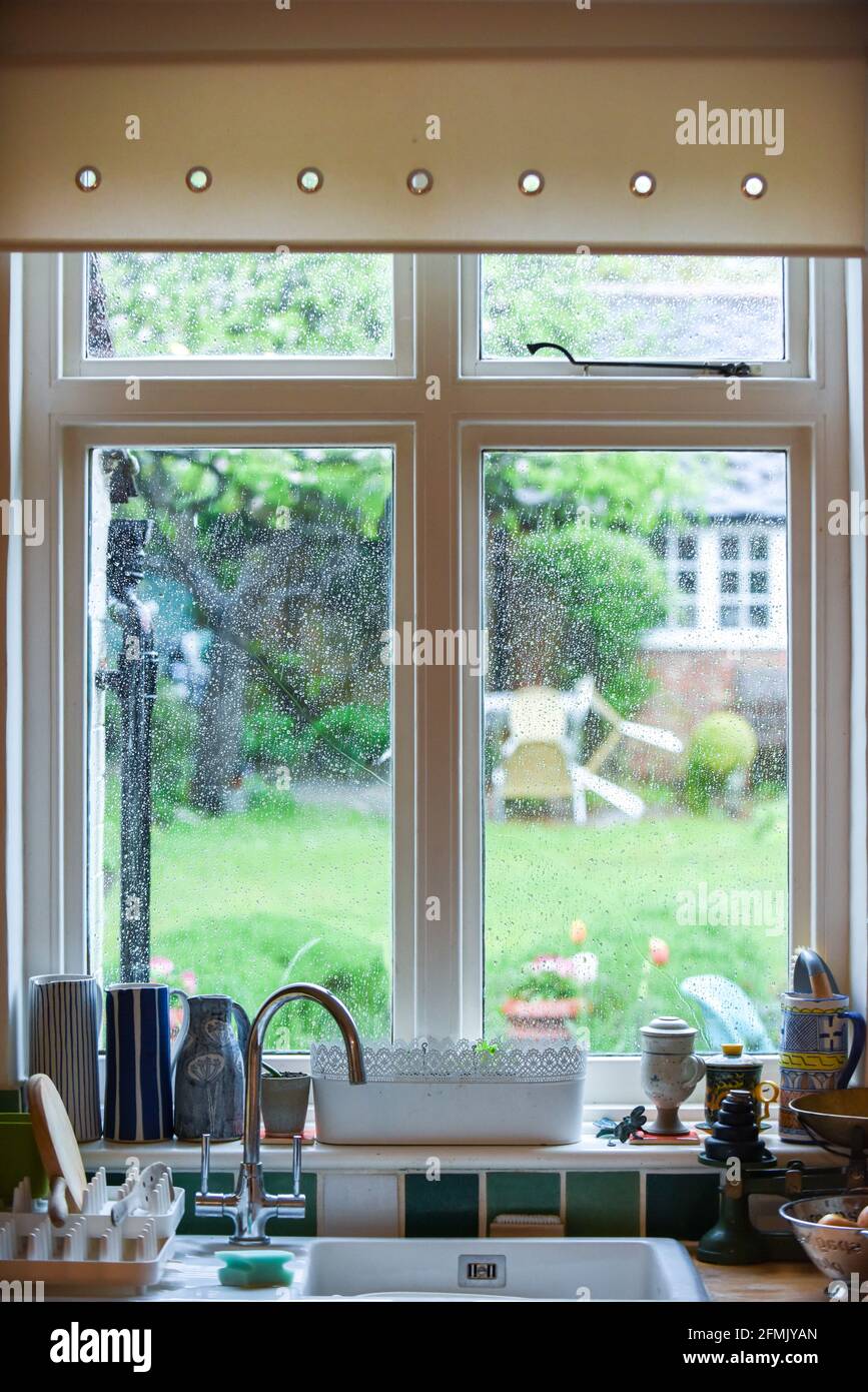 Kitchen interior view on a rainy day looking through window Stock Photo ...