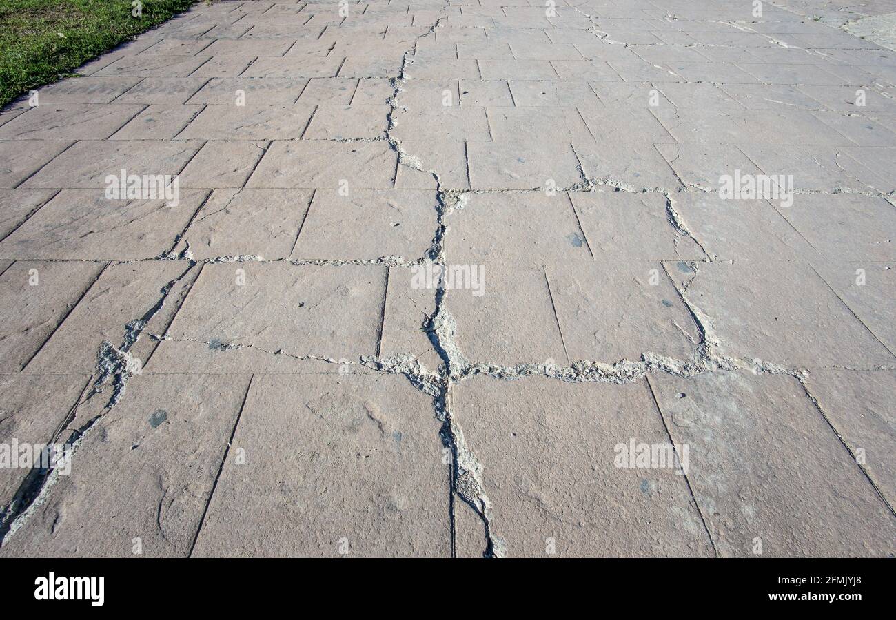 big break on damaged stamped concrete pavement outdoor, appearance ...