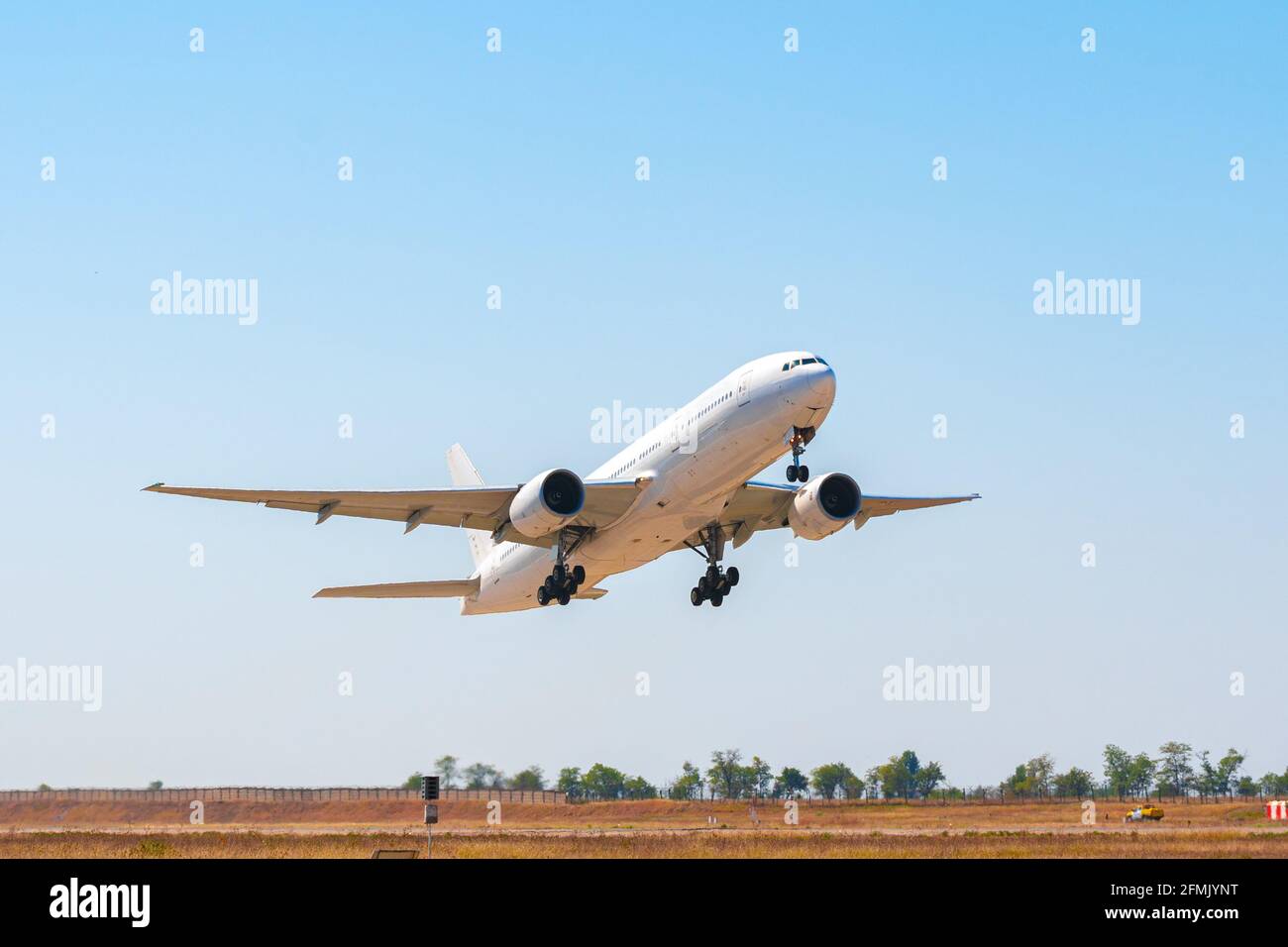 Passenger plane takes off from runway in airport Stock Photo - Alamy