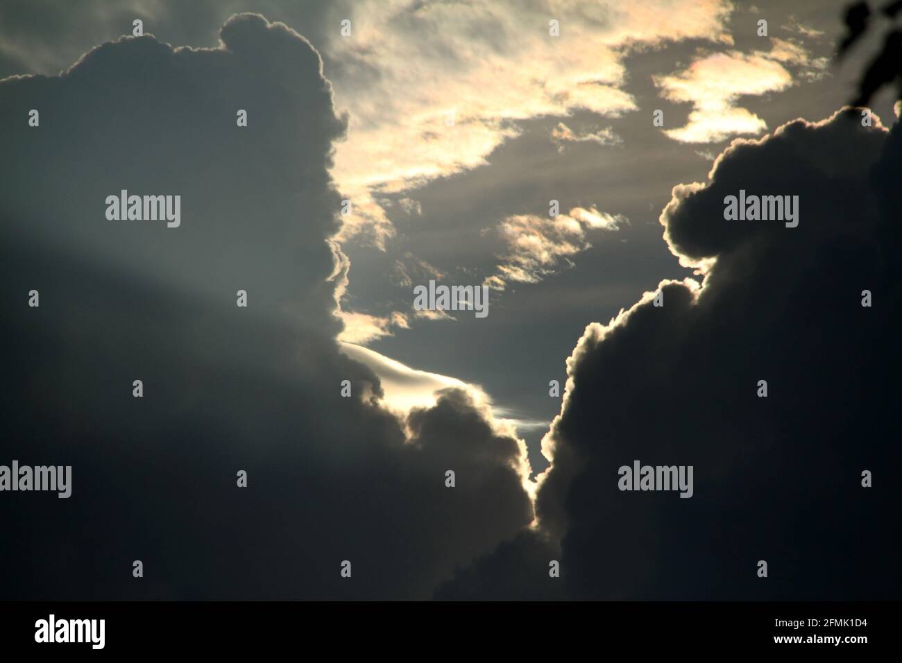 Dark large clouds covering the sun Stock Photo - Alamy