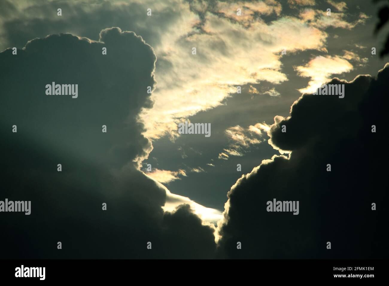 Dark large clouds covering the sun Stock Photo - Alamy