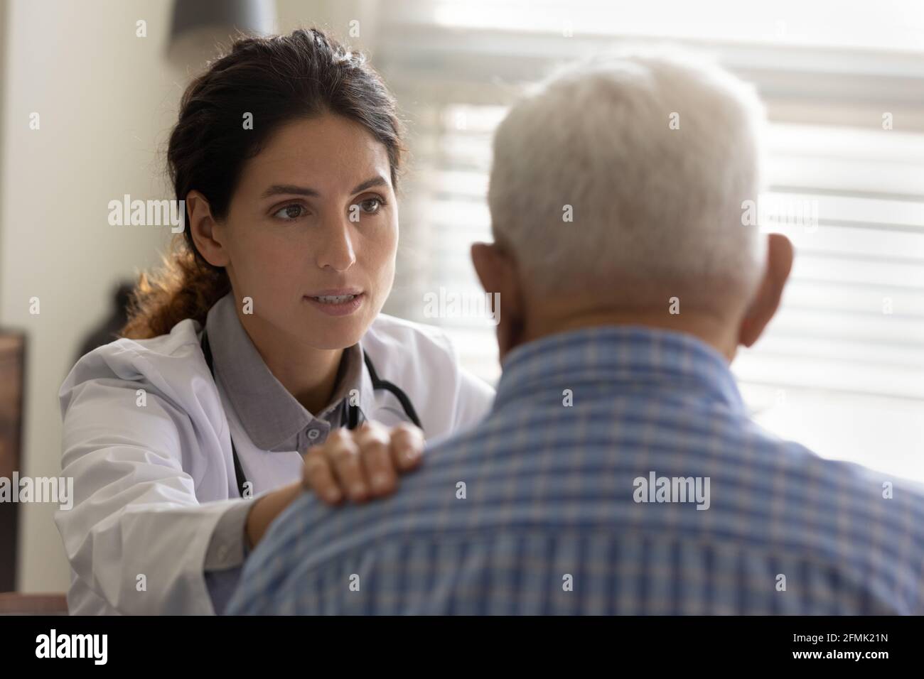 Mature oncologist talking man woman hi-res stock photography and images ...