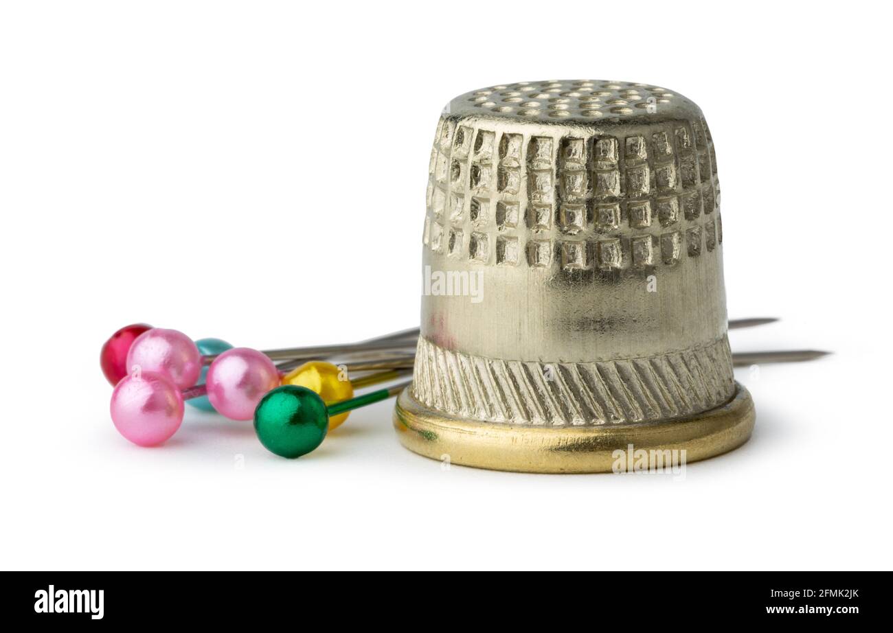 Metal sewing thimble isolated on white Stock Photo - Alamy