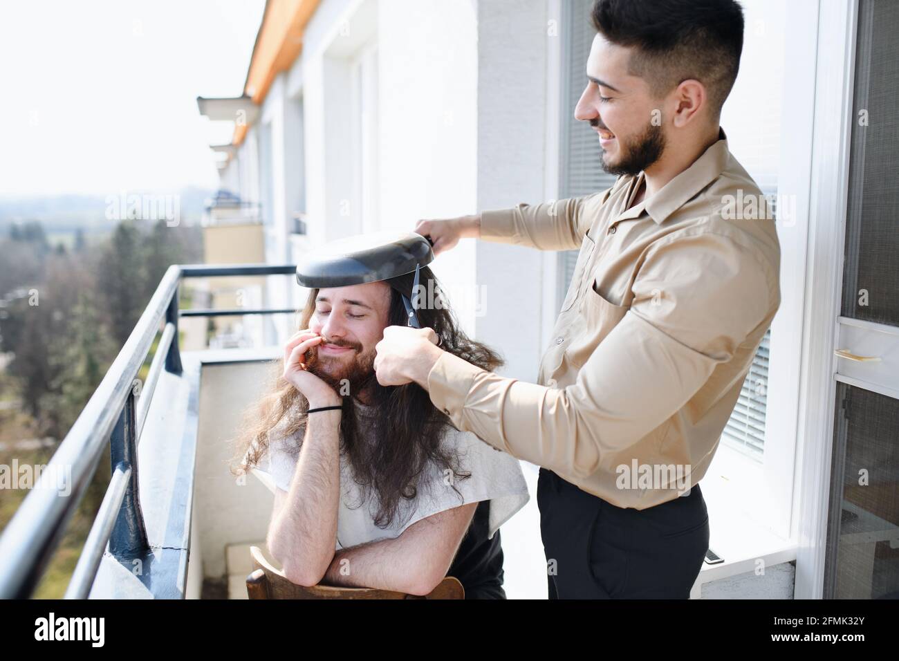 Haircut on balcony at home, coronavirus, lockdown and fun concept Stock ...