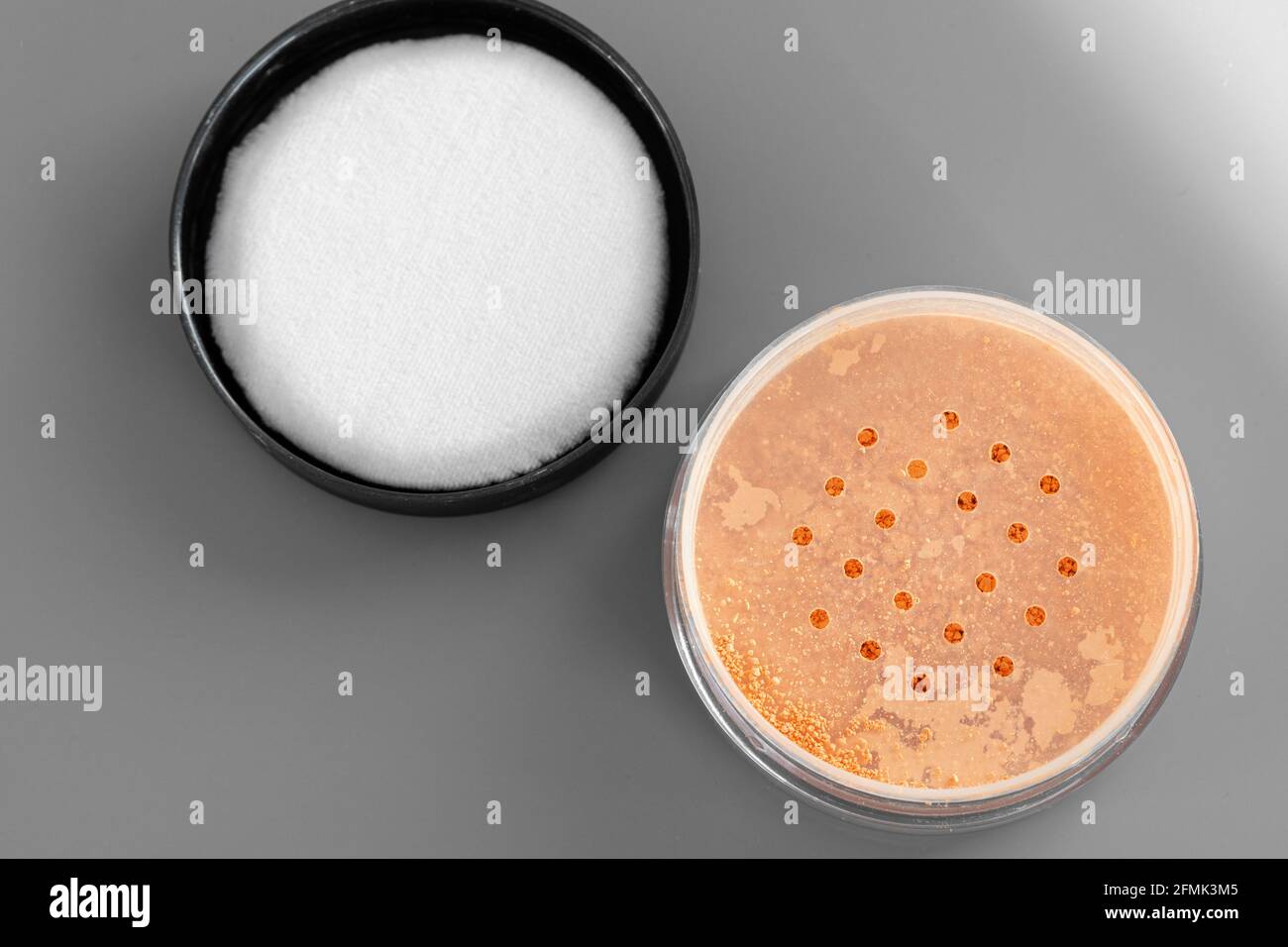 Open loose powder container on table close up Stock Photo - Alamy