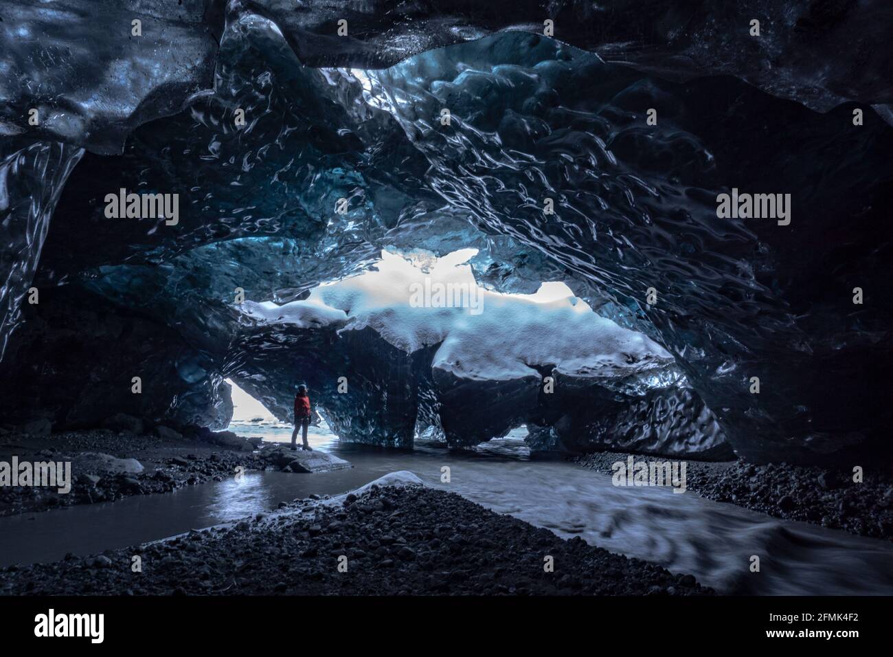 An explorer looks tiny in comparison to this glacier, the photographer ...