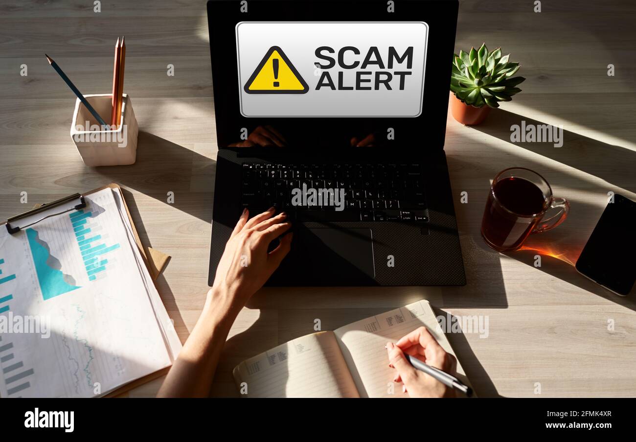 Scam alert detecting warning. Notification on device screen Stock Photo ...