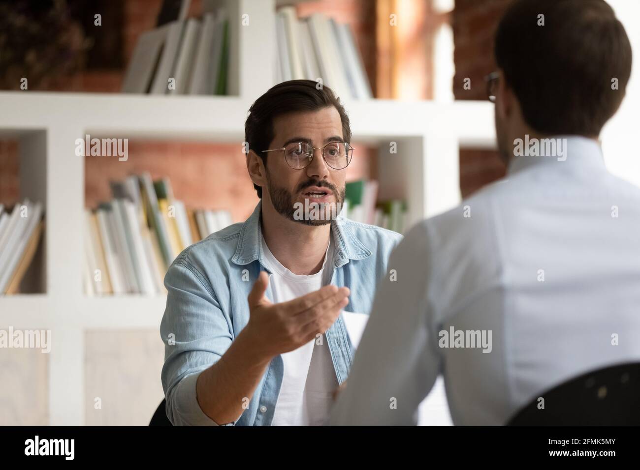 Hr manager employer asking questions to candidate on job interview ...