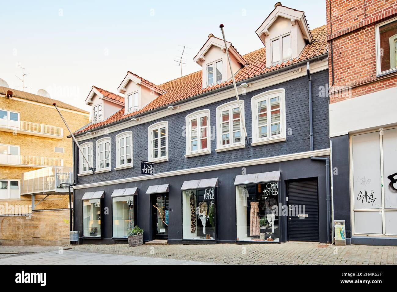 a clothing store black building with trendy clothes Stock Photo - Alamy